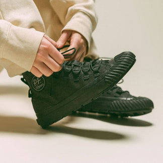 All-Black High-Top Sneakers With Military Roots, Rugged Canvas Comfort ...